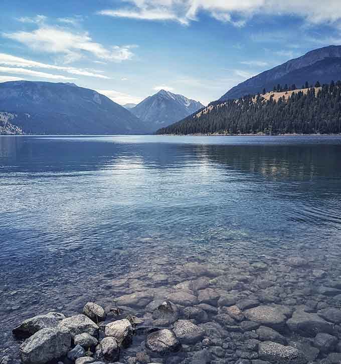 Wallowa Lake's clarity makes you question whether water is supposed to be this transparent, like nature's showing off now.