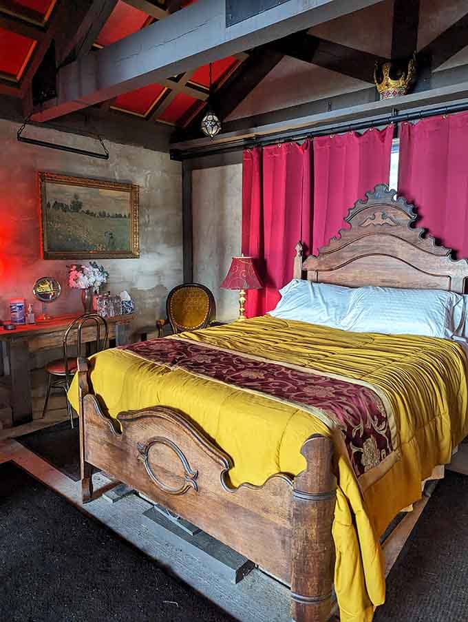 Sleep like medieval royalty in a carved wooden bed, complete with colorful linens and exposed beam ceilings overhead.