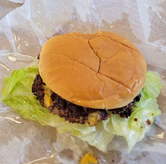 Fresh lettuce and a soft bun cradling that juicy patty is simple perfection that doesn't need any fancy explanations.
