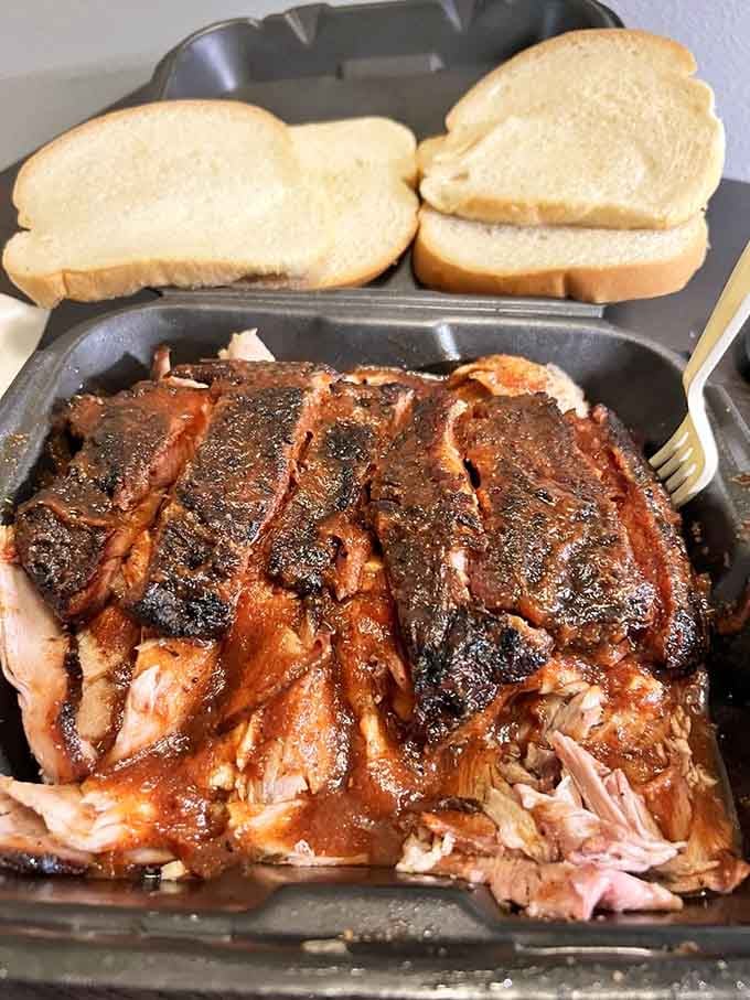 Pulled pork that's been loved by smoke for hours, ready to make your taste buds reconsider everything they knew.