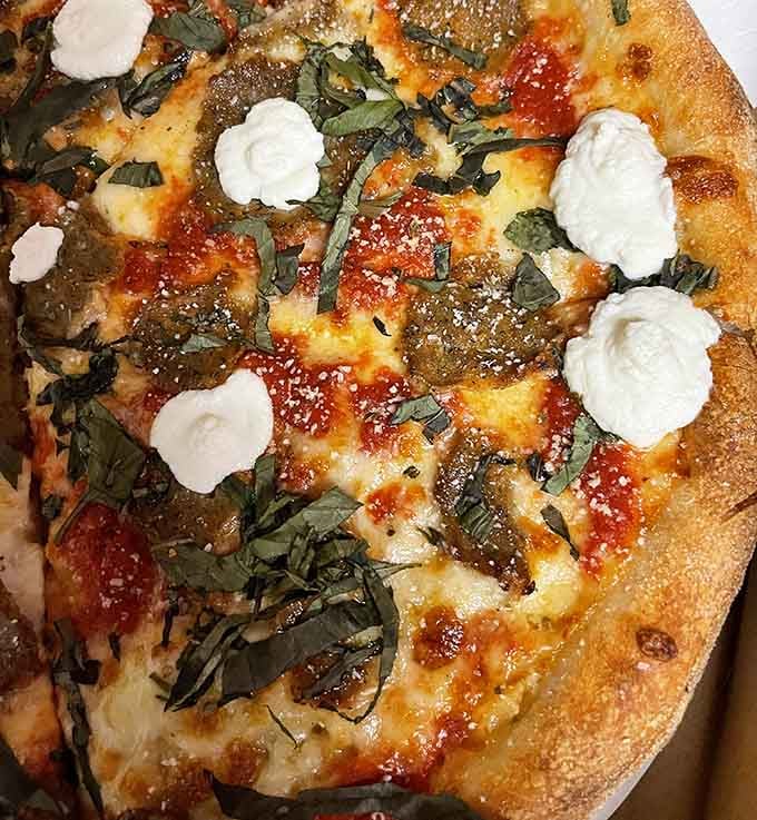 Pizza with ricotta dollops that look like tiny snowballs you actually want to eat.