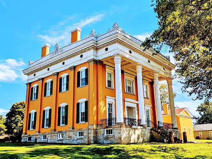 The Lanier Mansion's stately columns and golden facade make it the architectural equivalent of finding a Rolls Royce in a small-town parking lot.