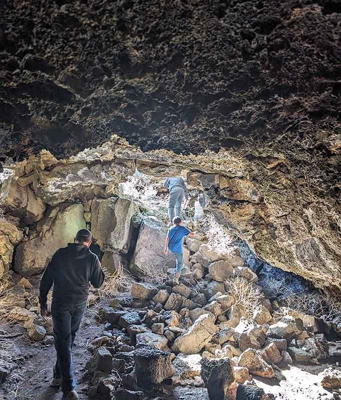 Visitors head into the caves, ready for adventure, equipped with maps and the thrill of discovery.