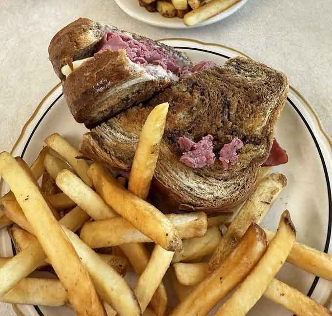 That Reuben sandwich paired with Greek fries is like a delicious international summit meeting happening right on your plate.