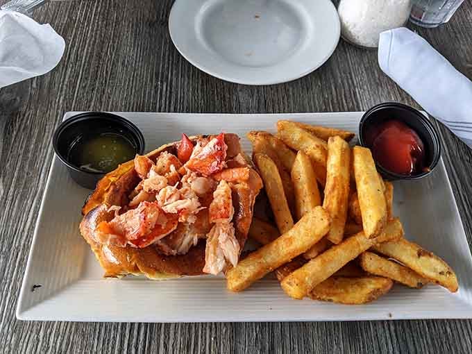The lobster roll here follows the golden rule: let the lobster do the talking while the butter nods approvingly.