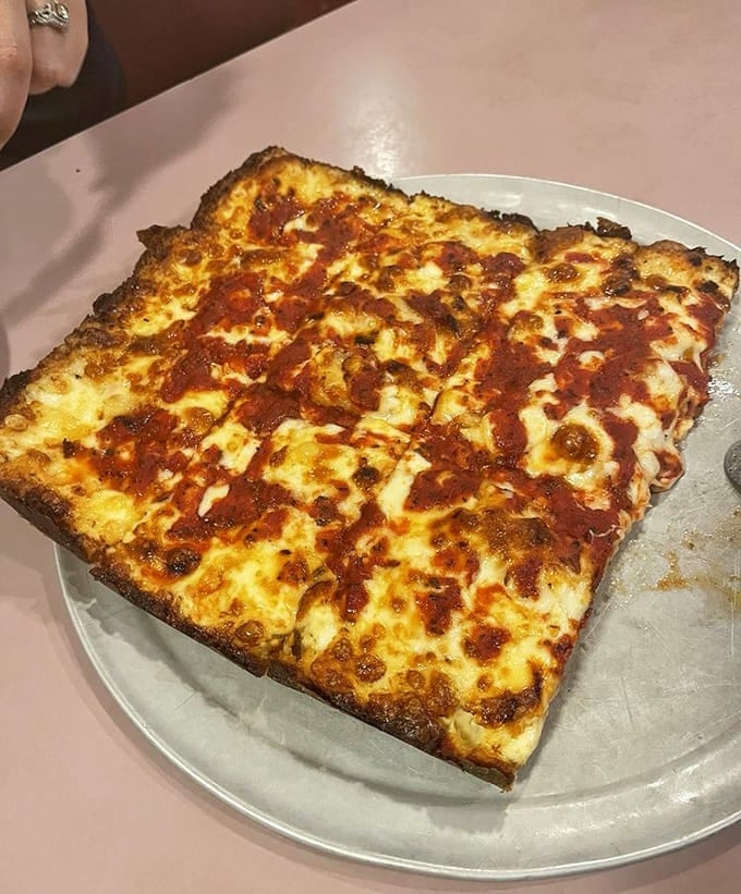 Golden, crispy, and covered in pepperoni, this square beauty proves geometry class was actually preparing you for pizza.