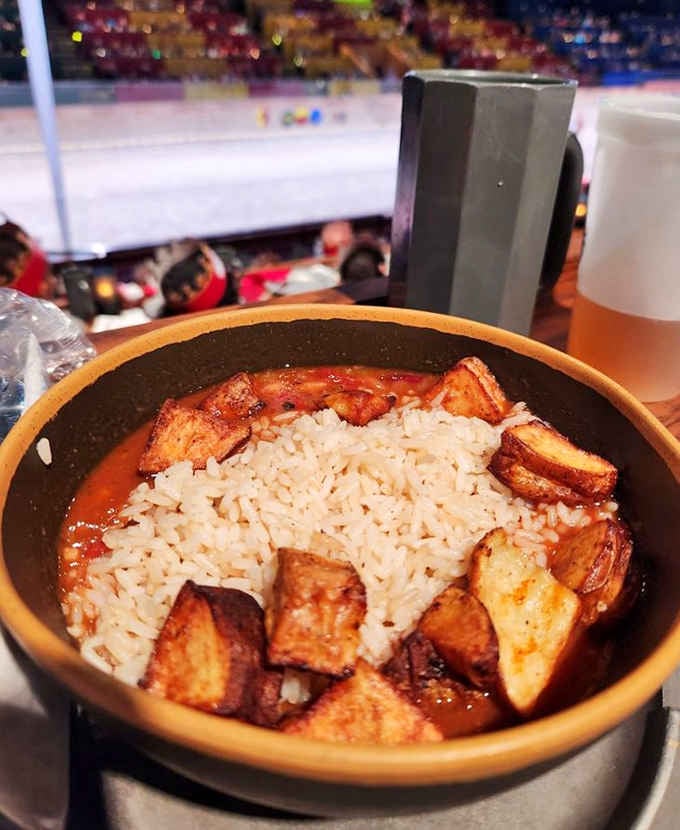 Rice, beans, and roasted potatoes arranged like edible architecture, proving carbs transcend all time periods beautifully.