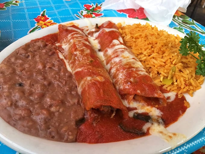 Brisket enchiladas smothered in sauce and cheese deliver comfort food that'll make you forget all your troubles, at least temporarily.