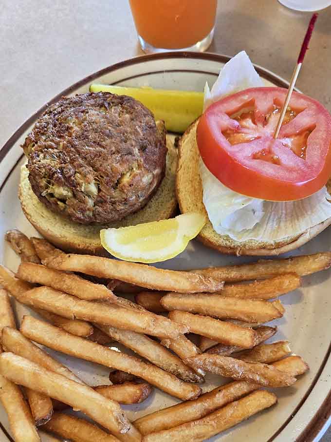 That crab cake sandwich is stacked higher than your expectations, and somehow it still manages to exceed them with every single bite.