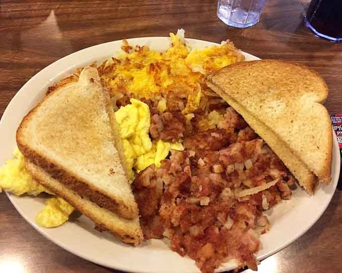 This corned beef hash plate is a masterclass in breakfast comfort—crispy potatoes, perfectly cooked eggs, and golden toast.