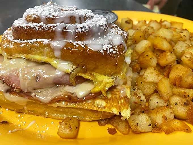 The Monte Cristo gets the royal treatment here, dusted with powdered sugar and stuffed with enough goodness to fuel your entire day.