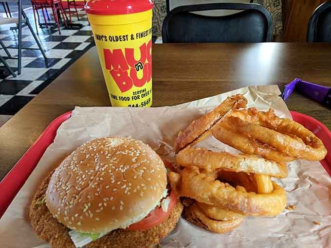When your tenderloin extends beyond the bun and those onion rings tower like edible architecture, you're doing Indiana right.