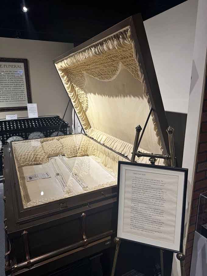 That's one seriously luxurious final resting place, complete with tufted satin interior that would make any decorator jealous.