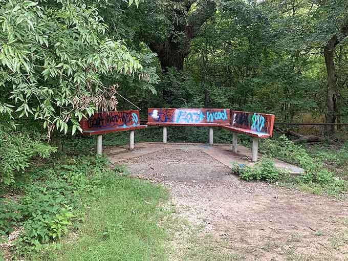 Even a bench near Old Alton Bridge gets decorated with graffiti, because apparently spirits aren't the only visitors.