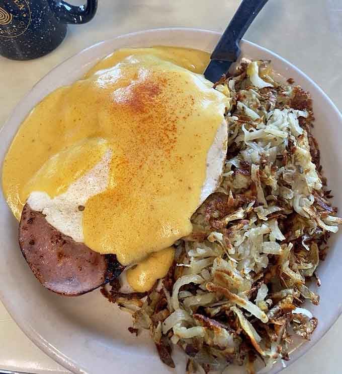 That hollandaise-covered perfection sitting on ham and English muffin is basically edible sunshine, and we're here for it.