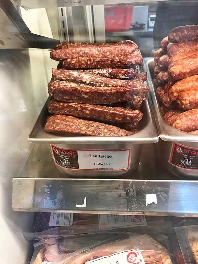 Landjaeger sausage stacked like edible Lincoln Logs—portable protein that actually tastes like something your ancestors would recognize.