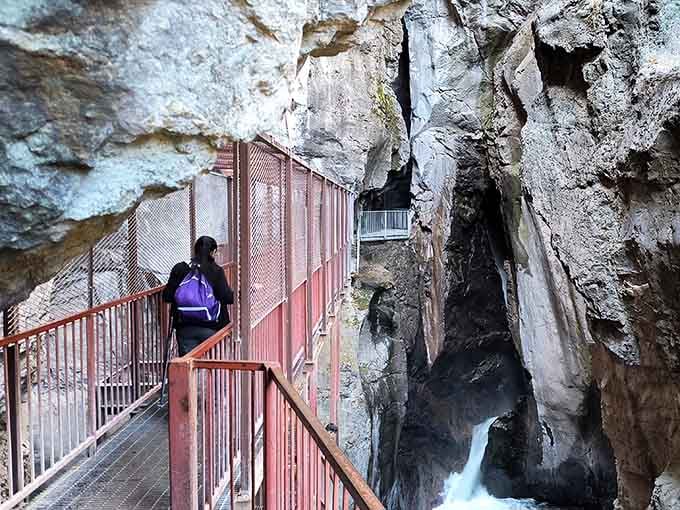Walking this catwalk means trusting century-old engineering while waterfalls thunder below, perfectly safe and perfectly thrilling.