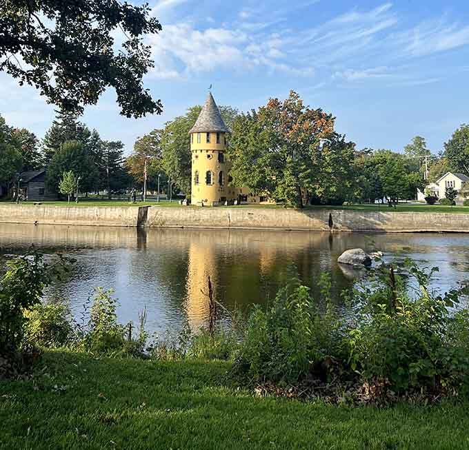 The castle's reflection in the Shiawassee River creates a postcard-perfect scene that photographers absolutely adore visiting.