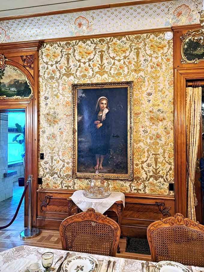 Victorian wallpaper and gilt frames proving that "too much" wasn't in the 1890s vocabulary, thankfully.