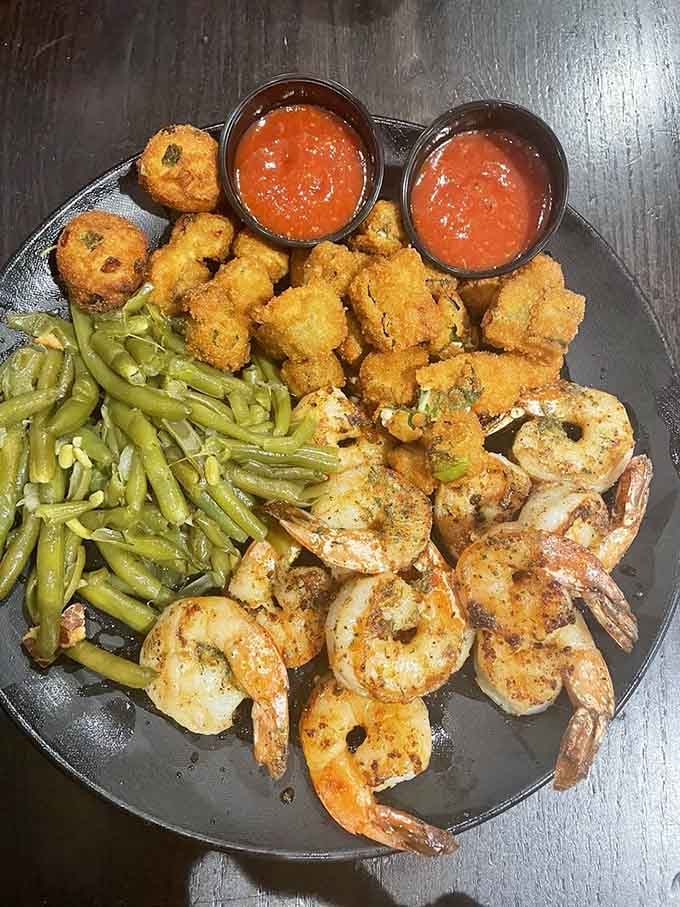 Perfectly grilled shrimp alongside fried okra and hushpuppies, because why choose one when you can have it all?