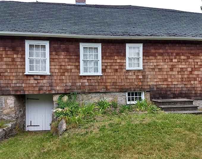 This cedar-shingled colonial treasure tells stories of early American life through its weathered clapboards and meticulously preserved windows.