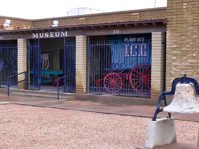 The Pinal County Historical Museum doesn't just preserve history—it celebrates it with quirky treasures like this vintage ice wagon behind those blue bars.