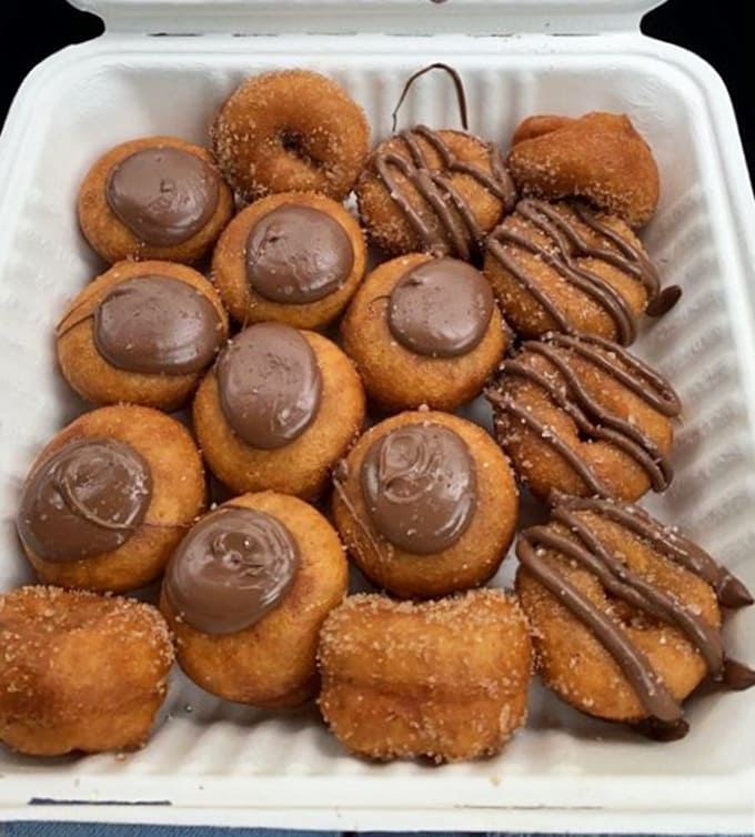 Chocolate-topped mini doughnuts arranged like edible treasures, because some things are worth their weight in cocoa and happiness.