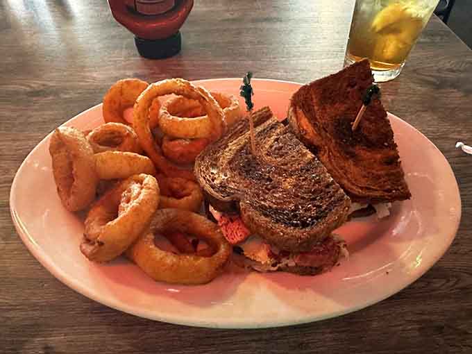 That Reuben sandwich paired with crispy onion rings is comfort food that even the melancholy poet would approve.