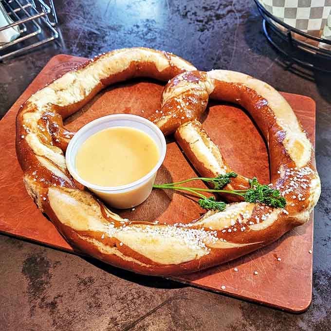 This isn't just any pretzel&mdash;it's a carb masterpiece that demands to be torn apart and dunked with reckless abandon. Bavarian geometry at its most delicious.