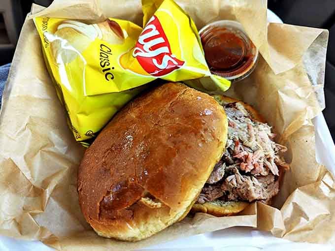 A sandwich that requires both hands and several napkins&mdash;the universal sign of BBQ excellence. The chips are just there for moral support.