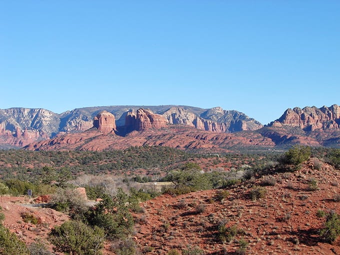 That perfect Arizona panorama where red earth meets endless sky in spectacular fashion.