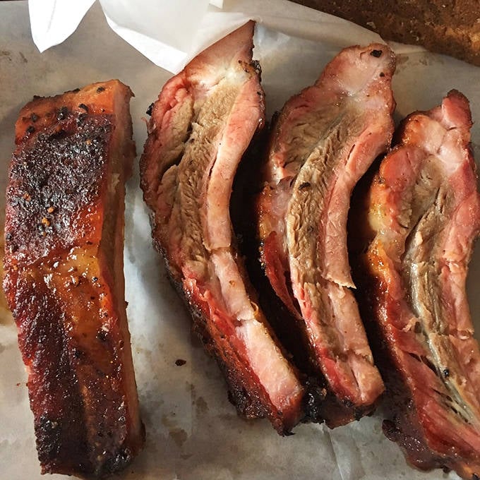 These ribs aren't falling off the bone &ndash; they're holding on just enough to maintain their dignity. That's the mark of perfect barbecue.