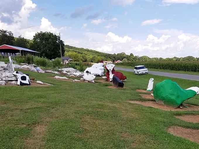 The view from the road reveals a landscape where painted creatures graze peacefully alongside actual working farmland.