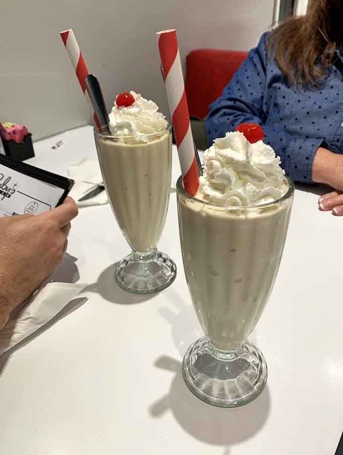 Classic vanilla shakes with striped straws, because sometimes the simplest pleasures are the most profound ones.