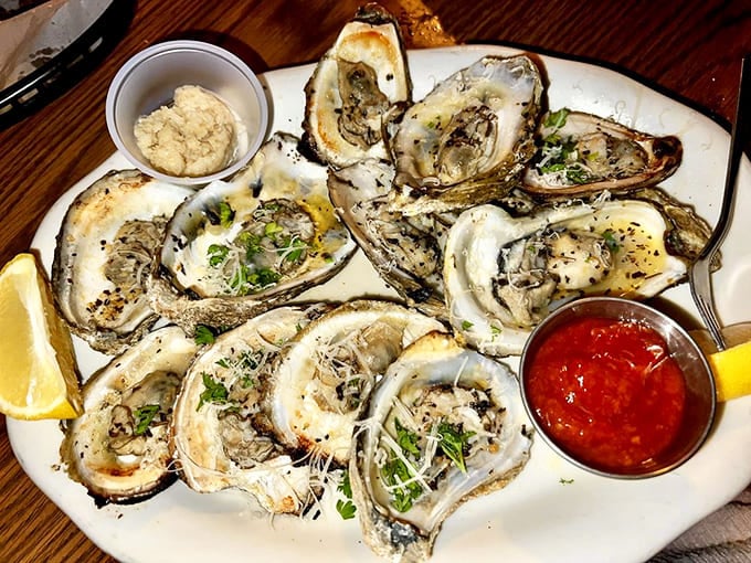 Grilled oysters topped with garlic butter and cheese make a compelling argument for cooking these briny beauties.