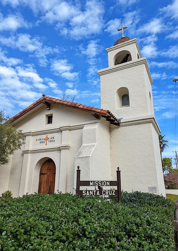 Mission Santa Cruz stands white and serene, a peaceful contrast to the town's colorful personality.