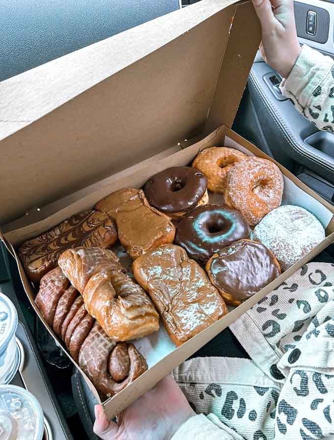 This box of assorted donuts represents every major food group that matters, and possibly a few new ones too.