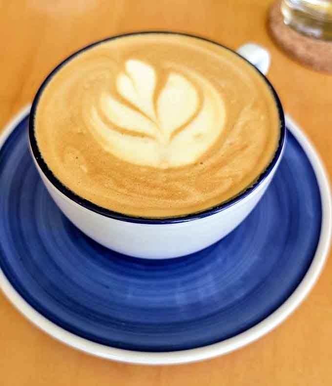 That latte art isn't showing off, it's Blueprint Coffee saying good morning in the most beautiful way possible.