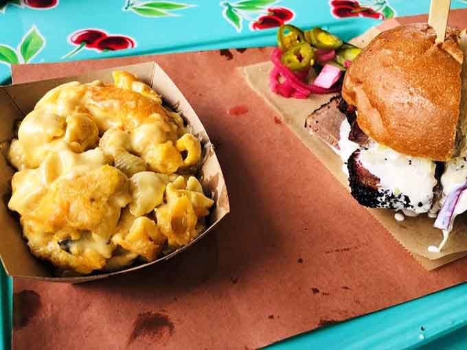 Creamy mac and cheese sits beside a burger that's become the stuff of legend across America.