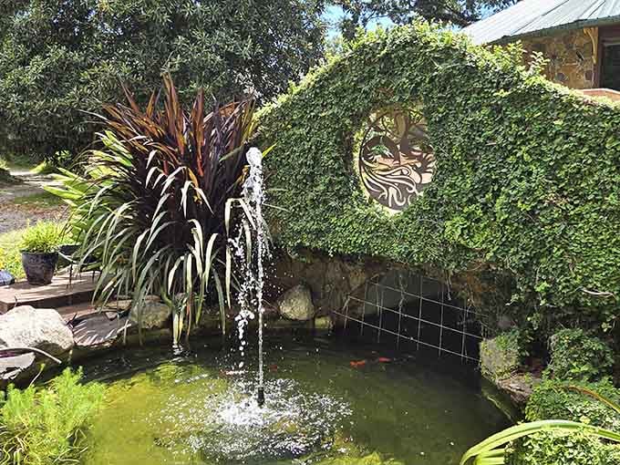 A tranquil fountain and koi pond prove that even castles need their own secret garden retreats.