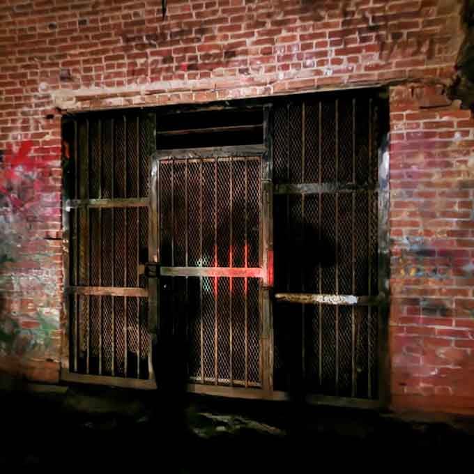 Behind locked gates lies the tunnel's deepest secret, where blue cheese once aged in perfect conditions.