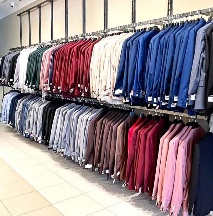 A rainbow of blazers and slacks standing at attention, ready to transform you from "Who's that?" to "Who's THAT?!" at your next office function.