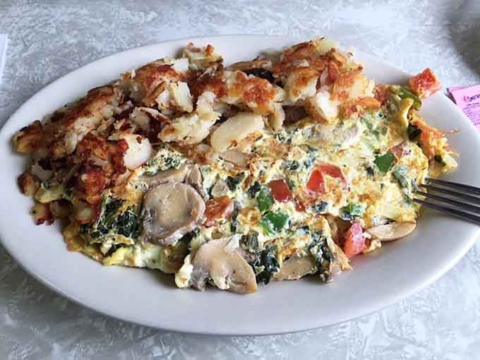 This veggie-packed omelet with crispy home fries shows that healthy choices can still be absolutely delicious.