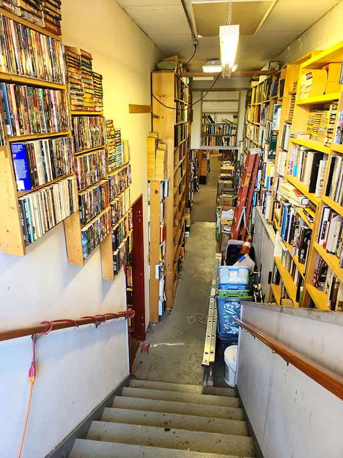 Narrow staircases lined with books create the ultimate bibliophile obstacle course, worth every careful step down.