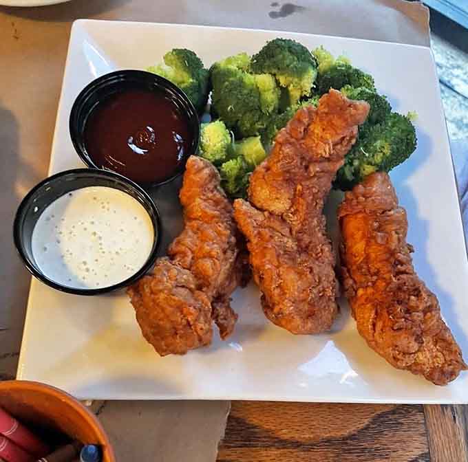 Chicken tenders that actually look like they came from a chicken, not a laboratory, served with the essentials.