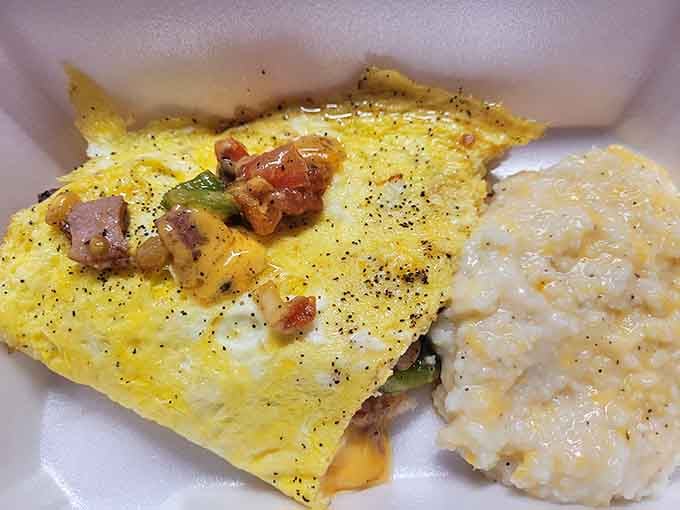 A loaded omelet paired with creamy grits delivers the kind of breakfast that powers you through any mountain adventure ahead.