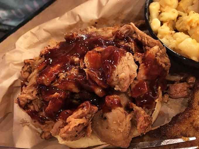 Pulled pork piled high and glistening with sauce, the kind of barbecue that makes napkins completely inadequate for the job.