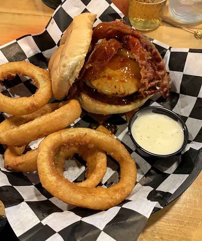 When a burger wears bacon and cheese like a crown, and onion rings serve as its loyal subjects.
