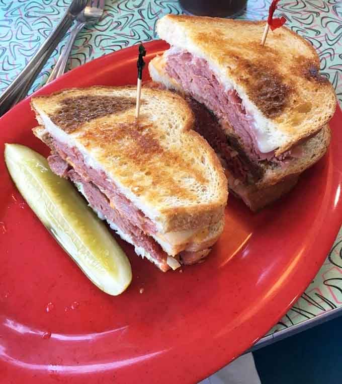 Stacked corned beef on toasted rye that would make any deli jealous of this diner's skills.