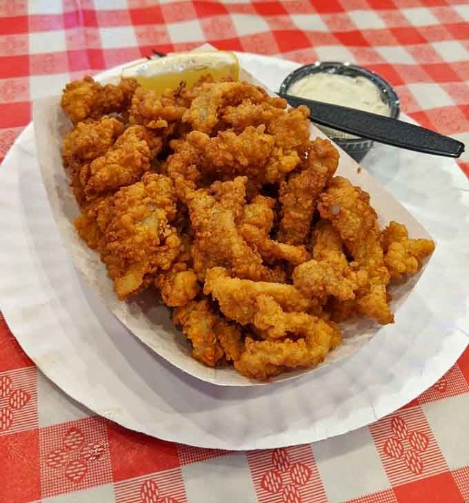 Golden, crispy fried clams that crunch on the outside and melt on the inside, served with tartar sauce for dipping.